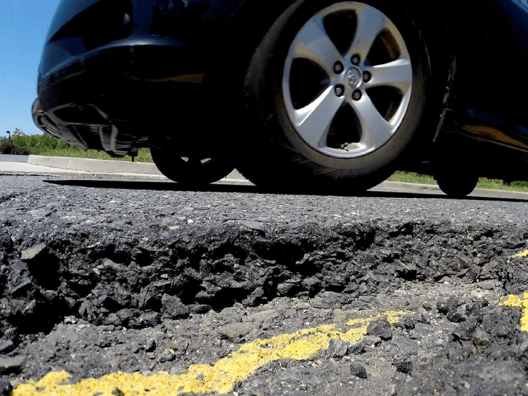 Who is responsible for auto damage from Potholes? | Texas Body Works